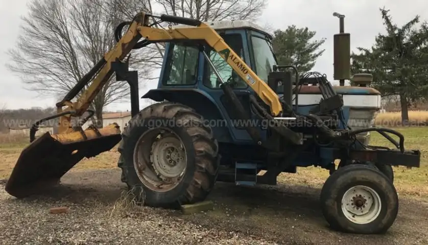 1983 Ford Tractor 7710 2WD with Alamo Reach Mower | AllSurplus
