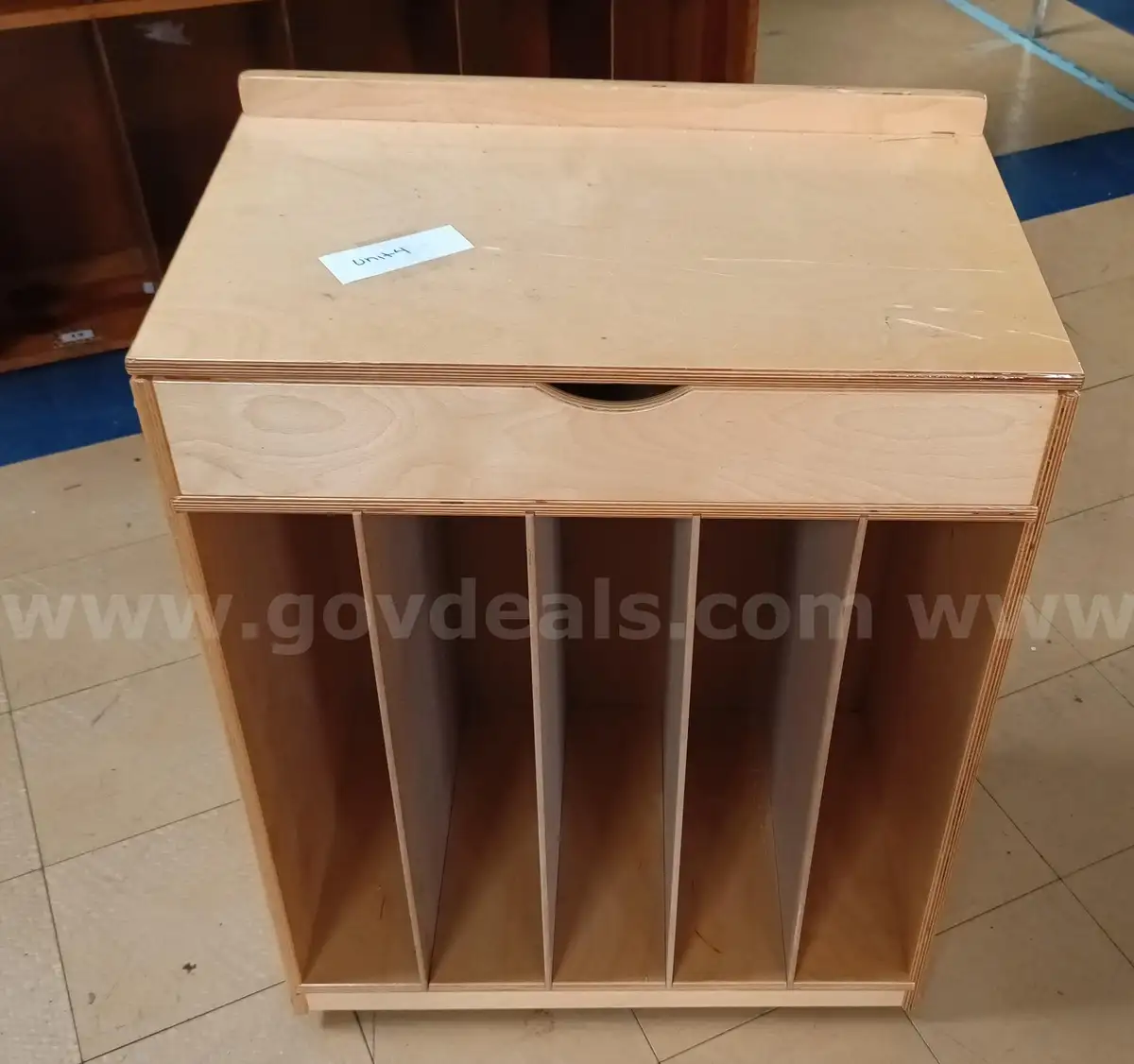 Wooden Cabinet with vertical slots & hinged covered storage space ...