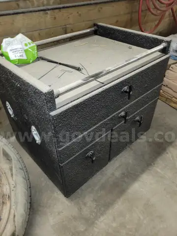 Squad car rear storage compartment | AllSurplus