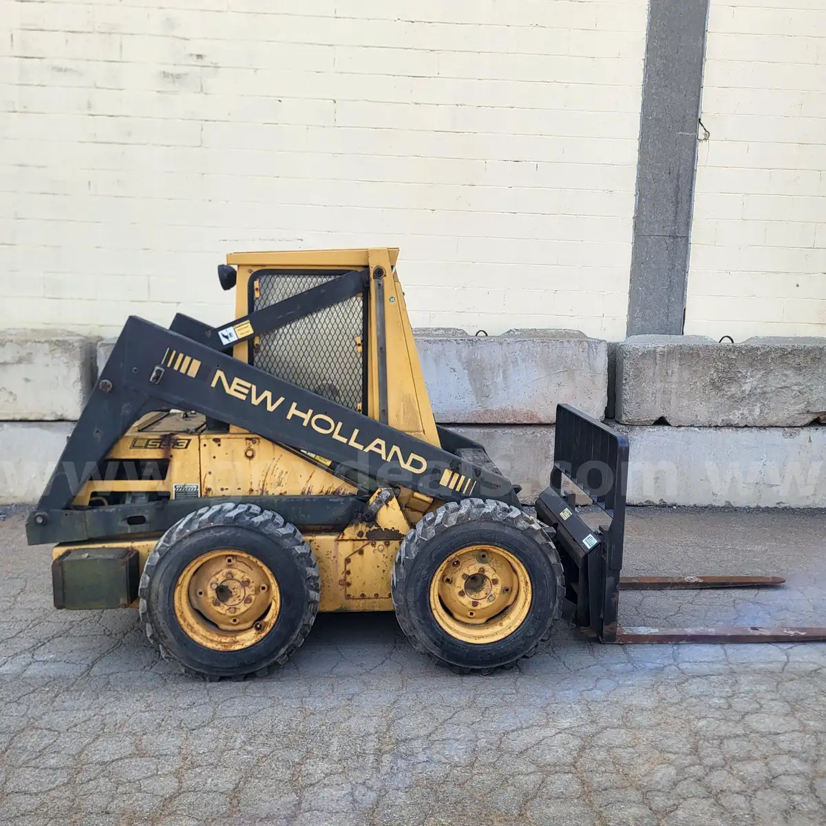FORD NEW HOLLAND SKID STEER L553 "630 HOURS" | AllSurplus