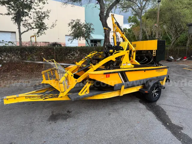 Weedoo Tiger Cat Aquatic Weed Harvester boat with Front loader | AllSurplus