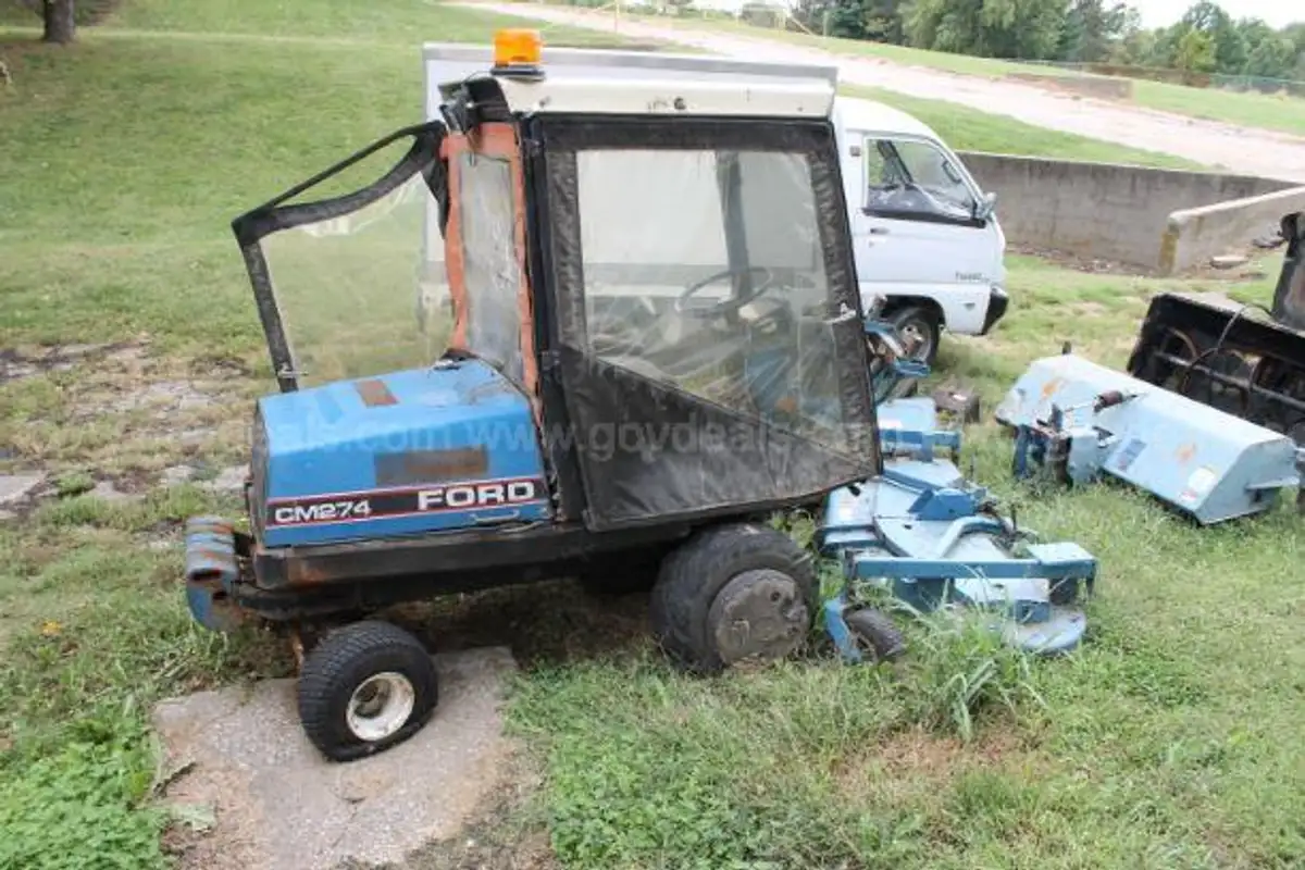 Ford CM 274 Mower with Mower Deck, Broom and Snow Blower Plow. | AllSurplus